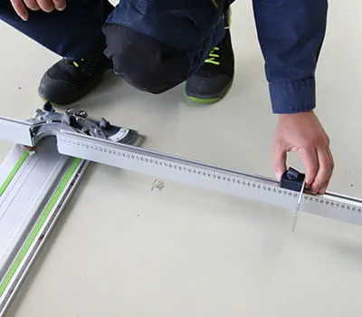 Cutting insulation between rafters for pipe openings