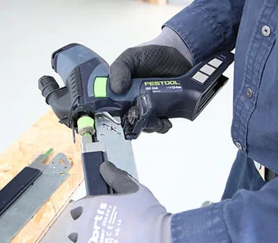 Cutting insulation between rafters for pipe openings